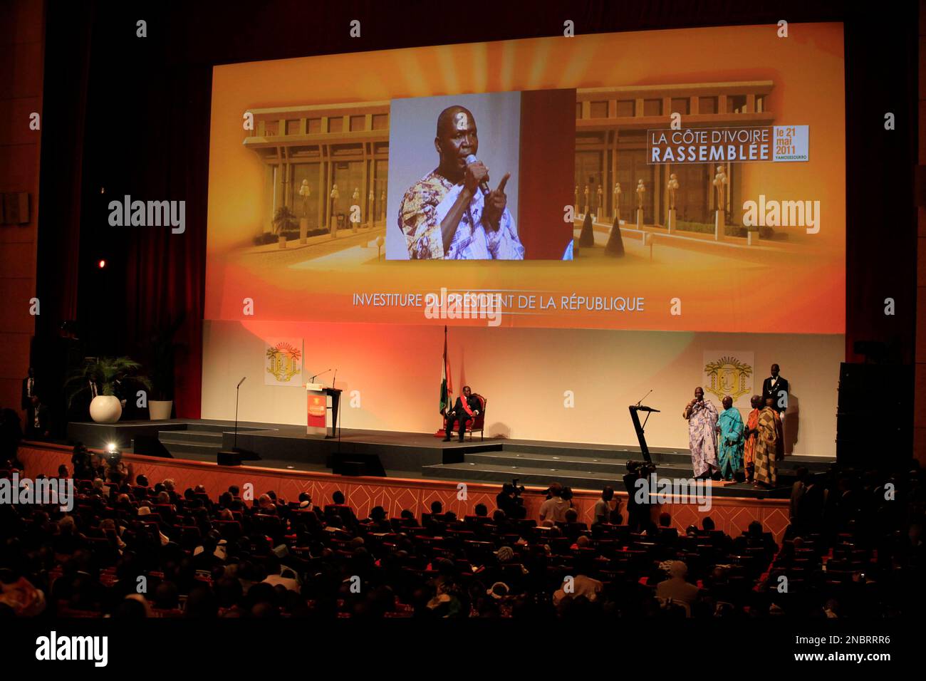 Traditional chiefs, right, perform a libation during the inauguration ...