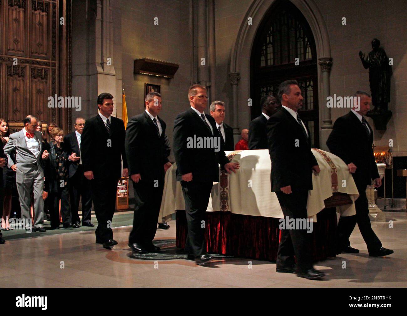 Delores Gallo, second from left, lock arms between sons Bill Gallo, Jr ...