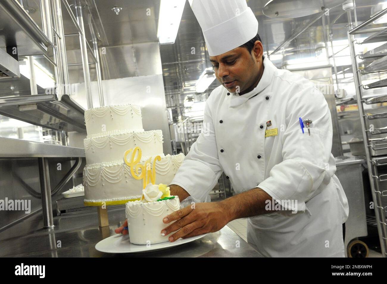 Cunard Line's Executive Pastry Chef Bosco Dourado puts the "Catherine ...