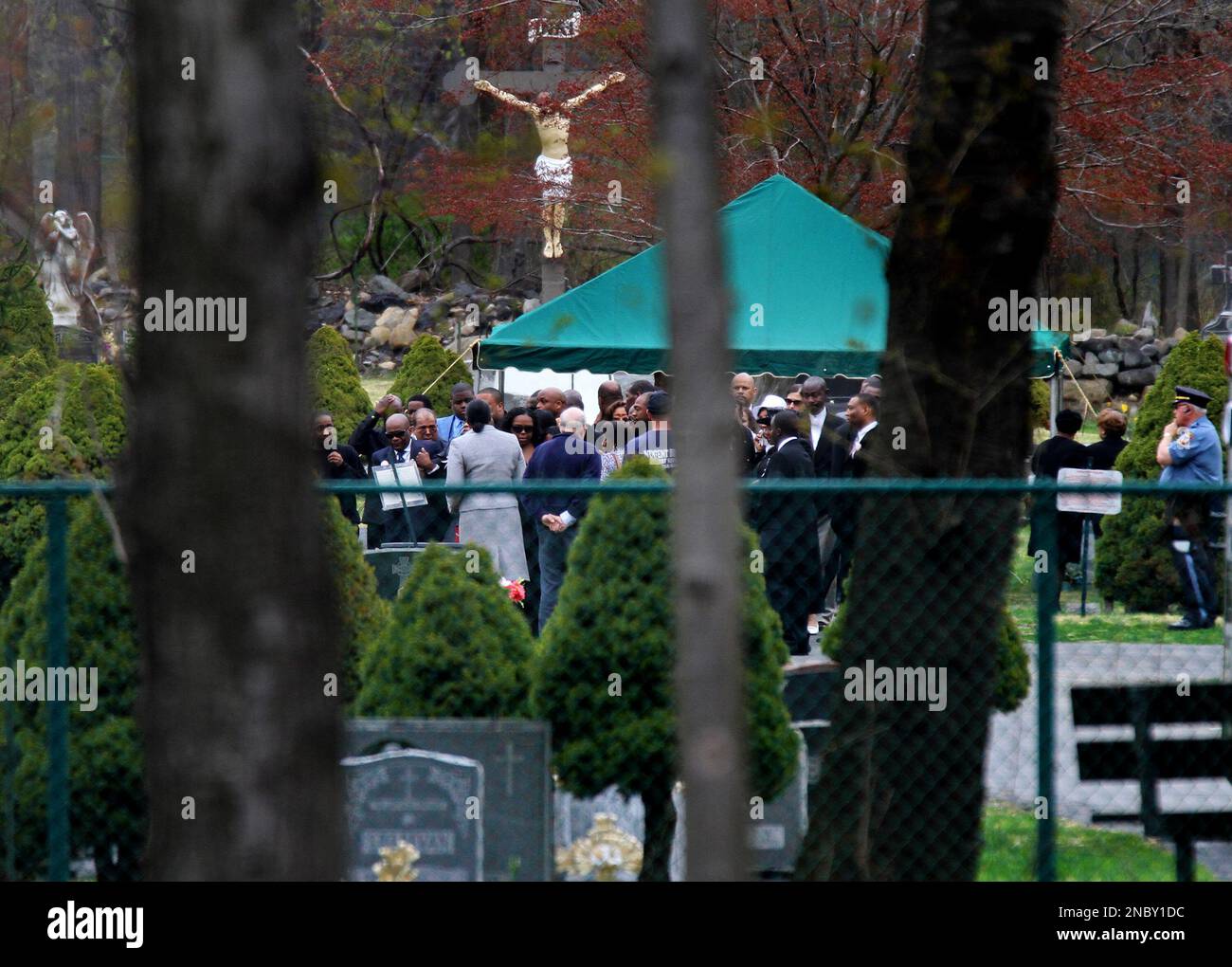 Mourners gather at Gethsemane Cemetery, in Congers, N. Y. Monday, April ...