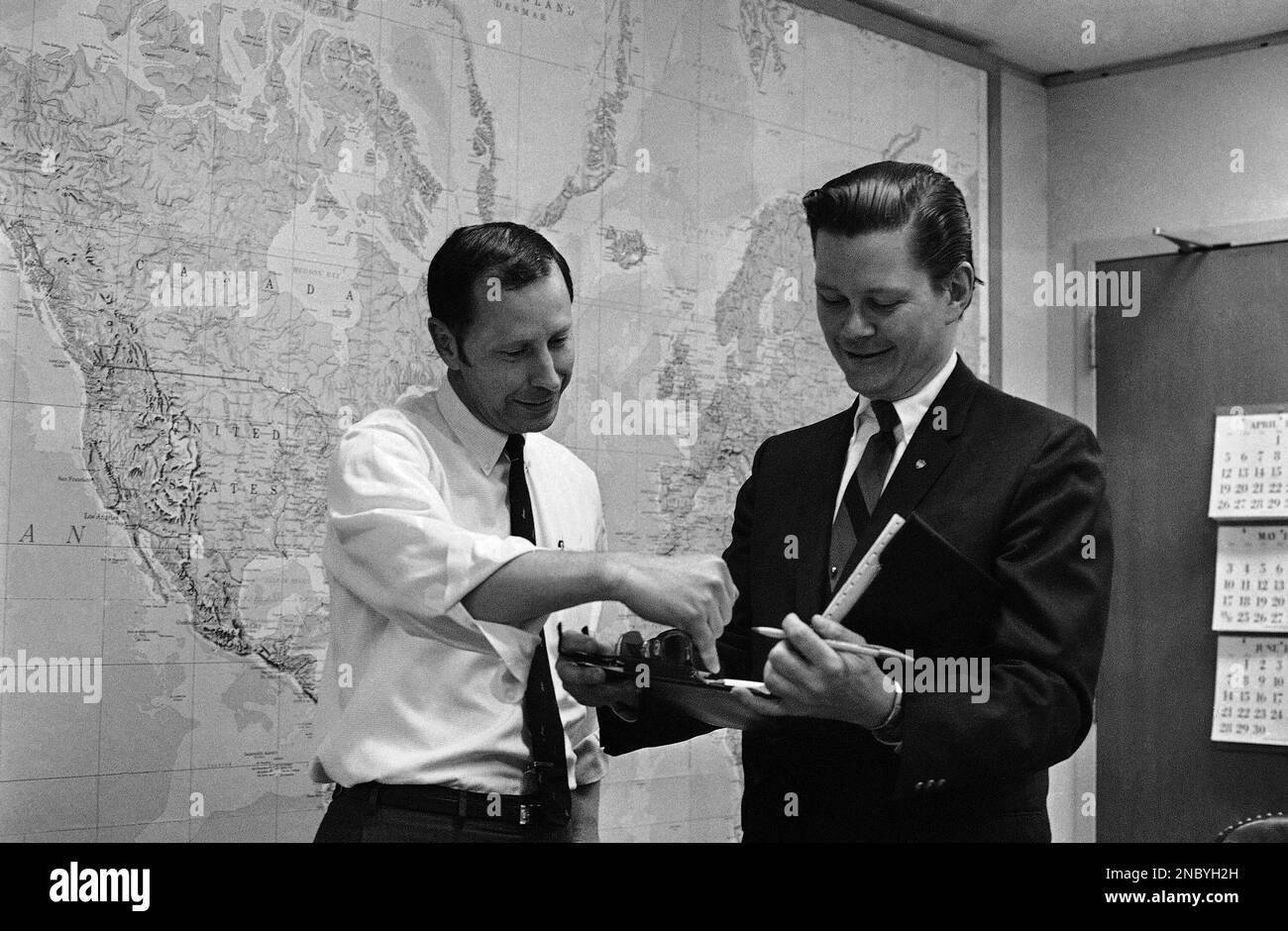 State Department courier Steve Greenway, left, double checks his ...