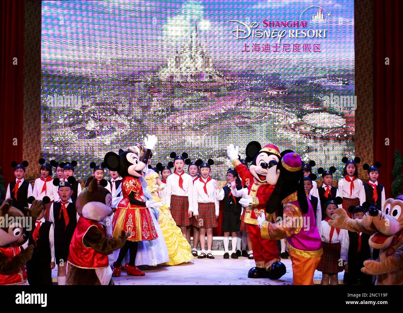 Walt Disney cartoon characters perform with Chinese children during a ...