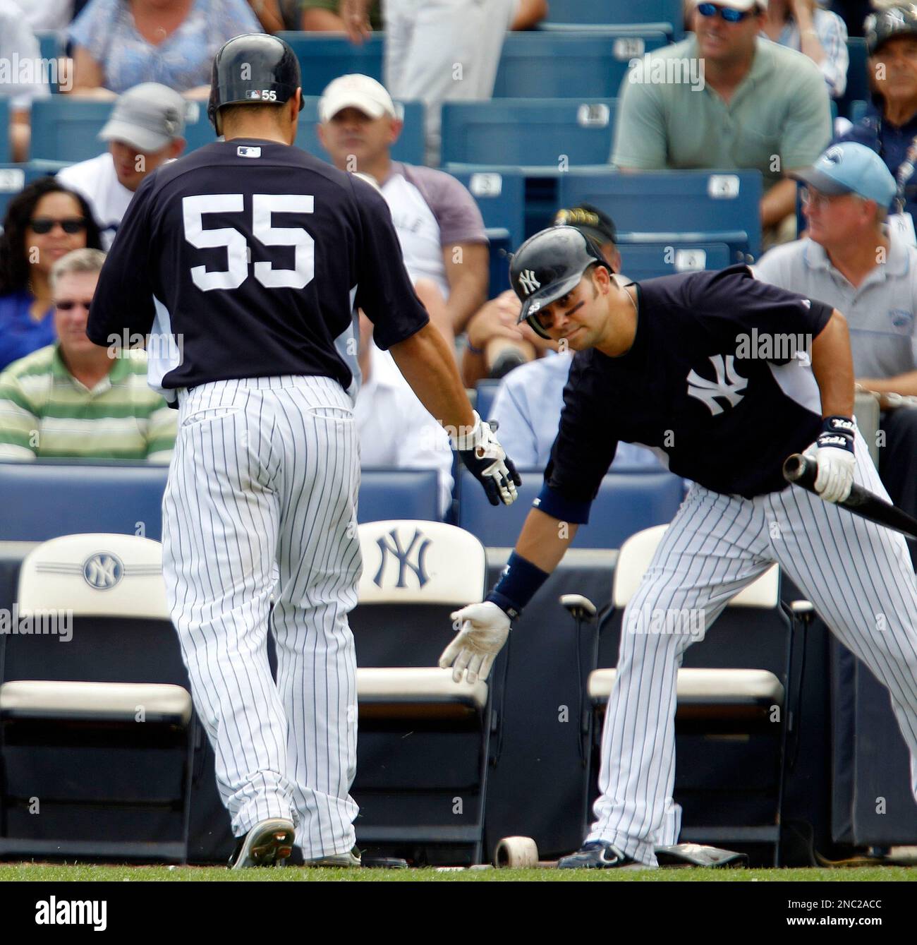 New York Yankees' Nick Swisher, right, greets Russell Martin (55) after ...