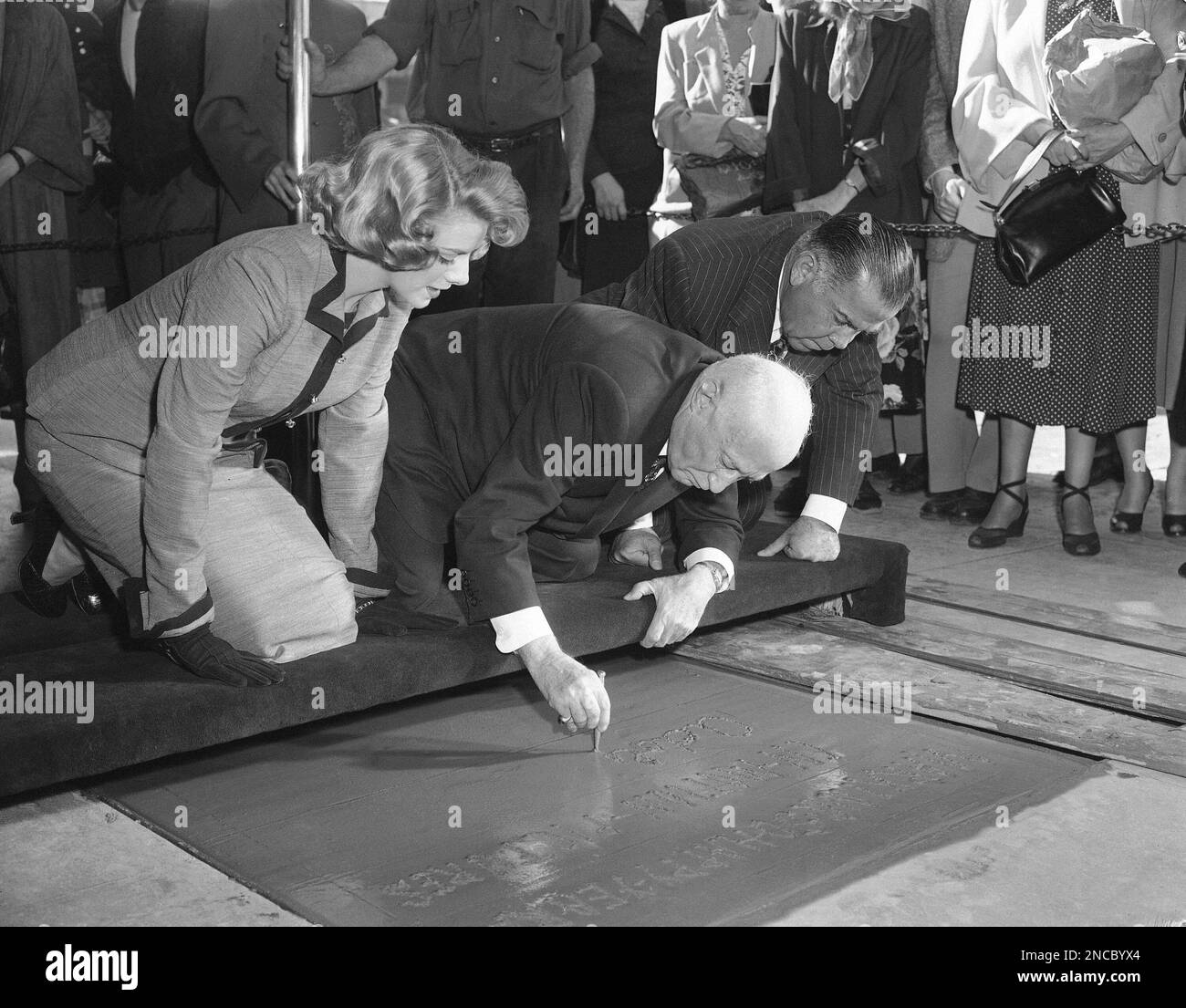 Adolph Zukor, movie pioneer, writes his name in concrete at Grauman's ...