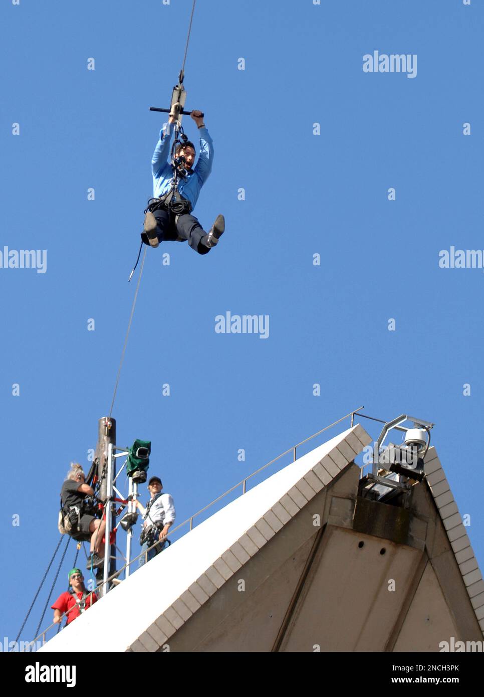 Australian actor Hugh Jackman makes an aerial entrance on a flying fox ...