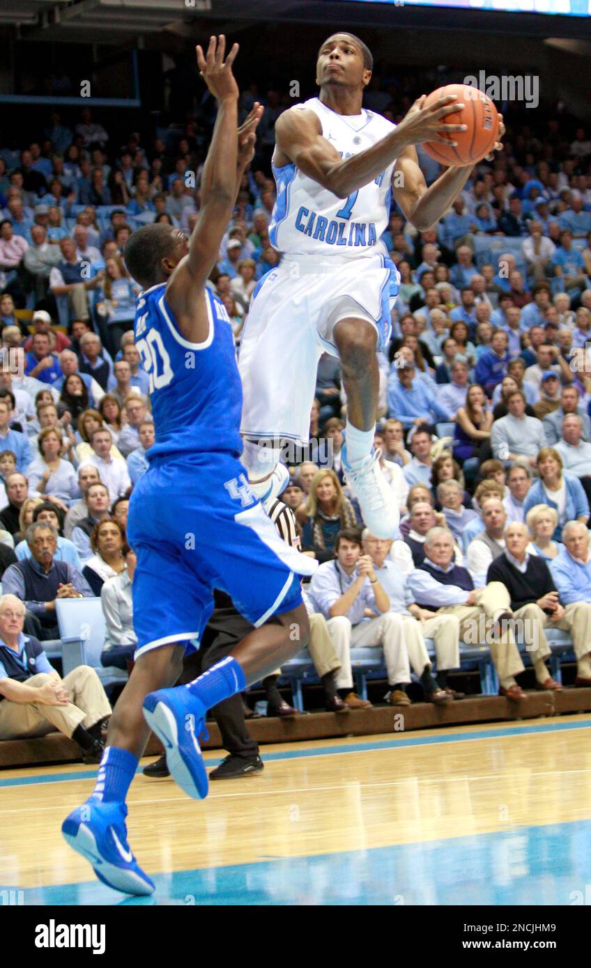Kentucky's Doron Lamb (20) defends as North Carolina's Dexter ...