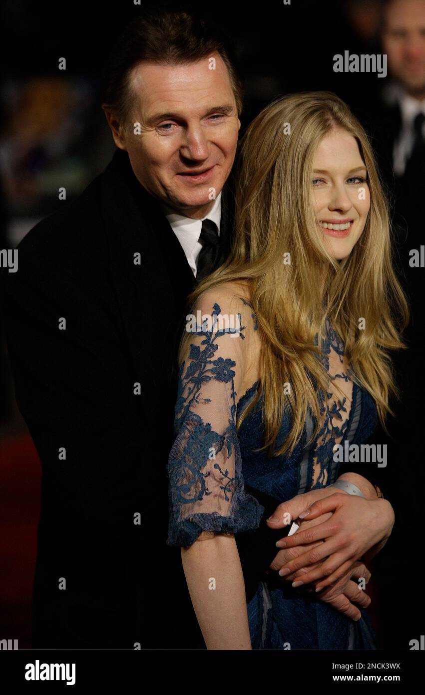 Actors Liam Neeson hugs Laura Brent as they arrive for the World premiere of The Chronicles of ...