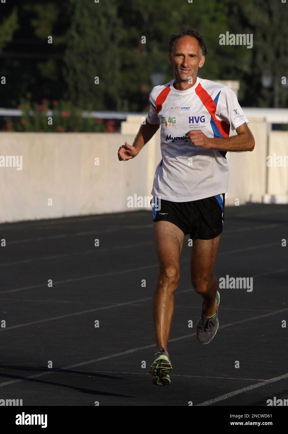 German ultramarathon runner Jurgen Mennel finishes his run at the ...