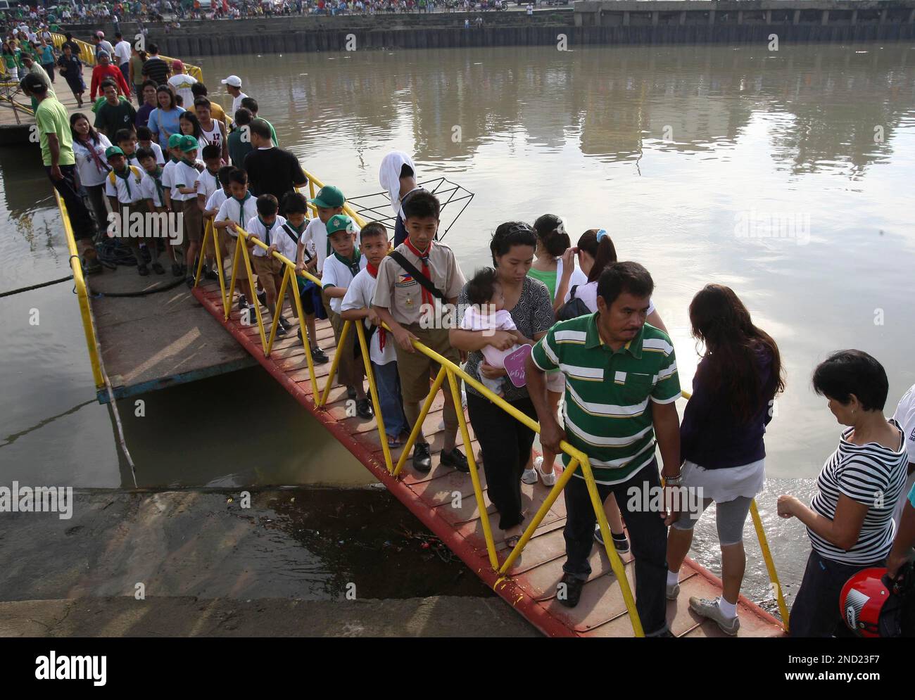 Residents cross the rehabilitated Marikina River using an improvised ...