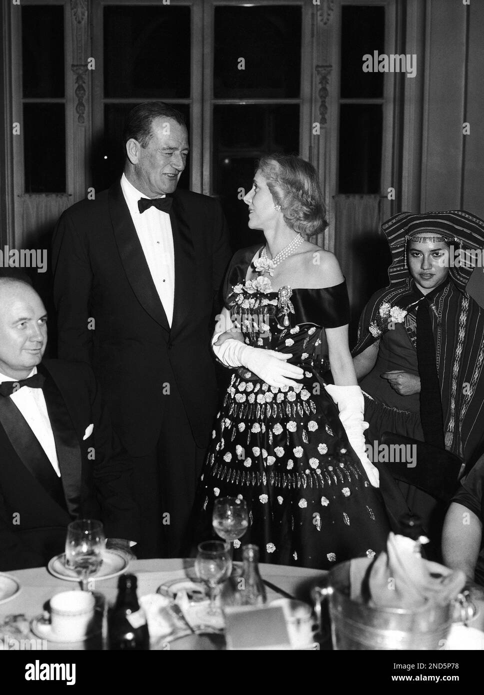 American film actor, John Wayne, literally assailed by autograph ...