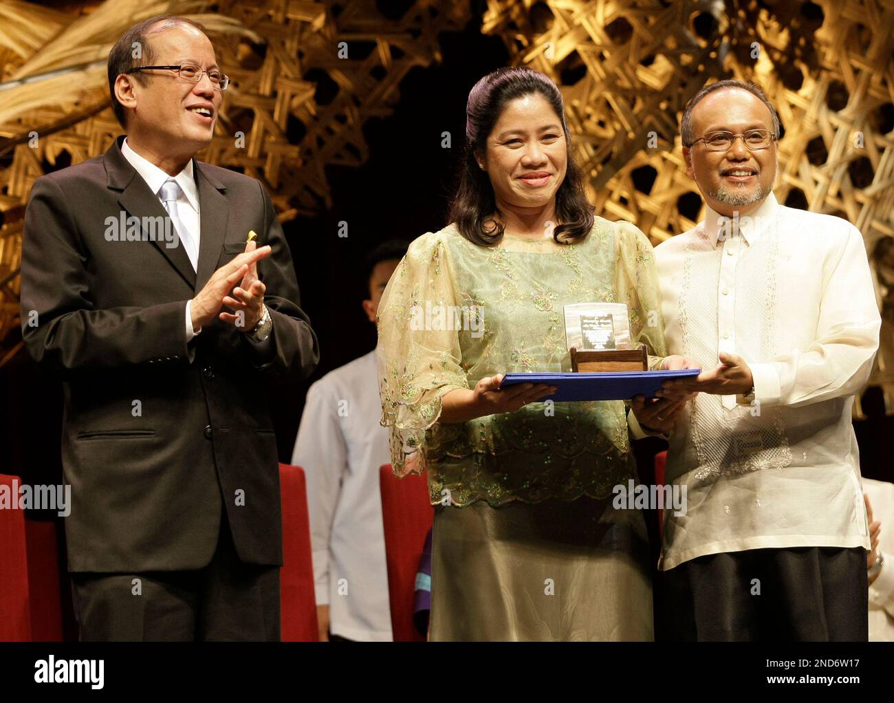 President Benigno Aquino III, left, celebrates Christopher Bernido and ...