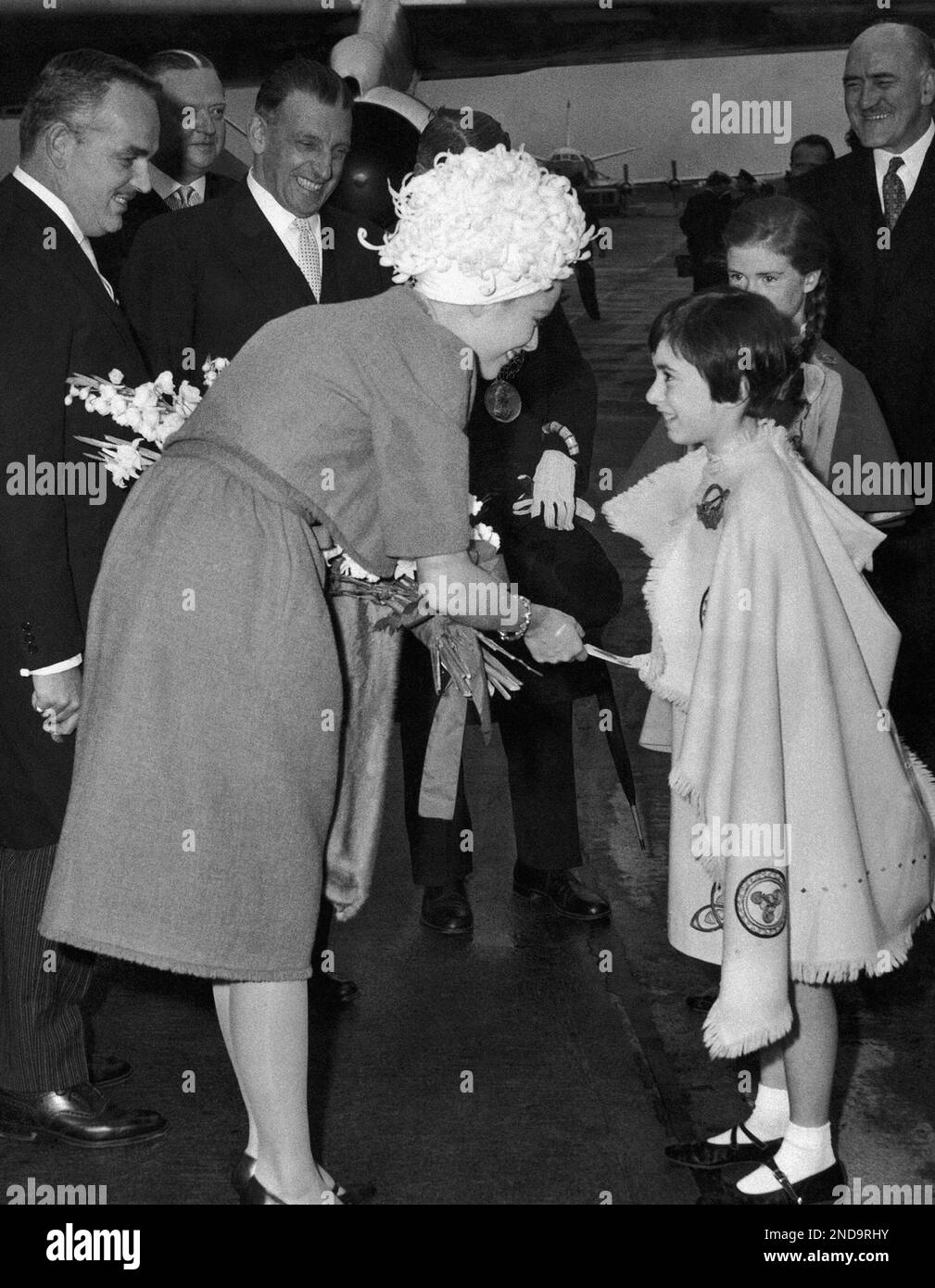 Princess Grace of Monaco bends to hear welcoming words by Eithne de ...