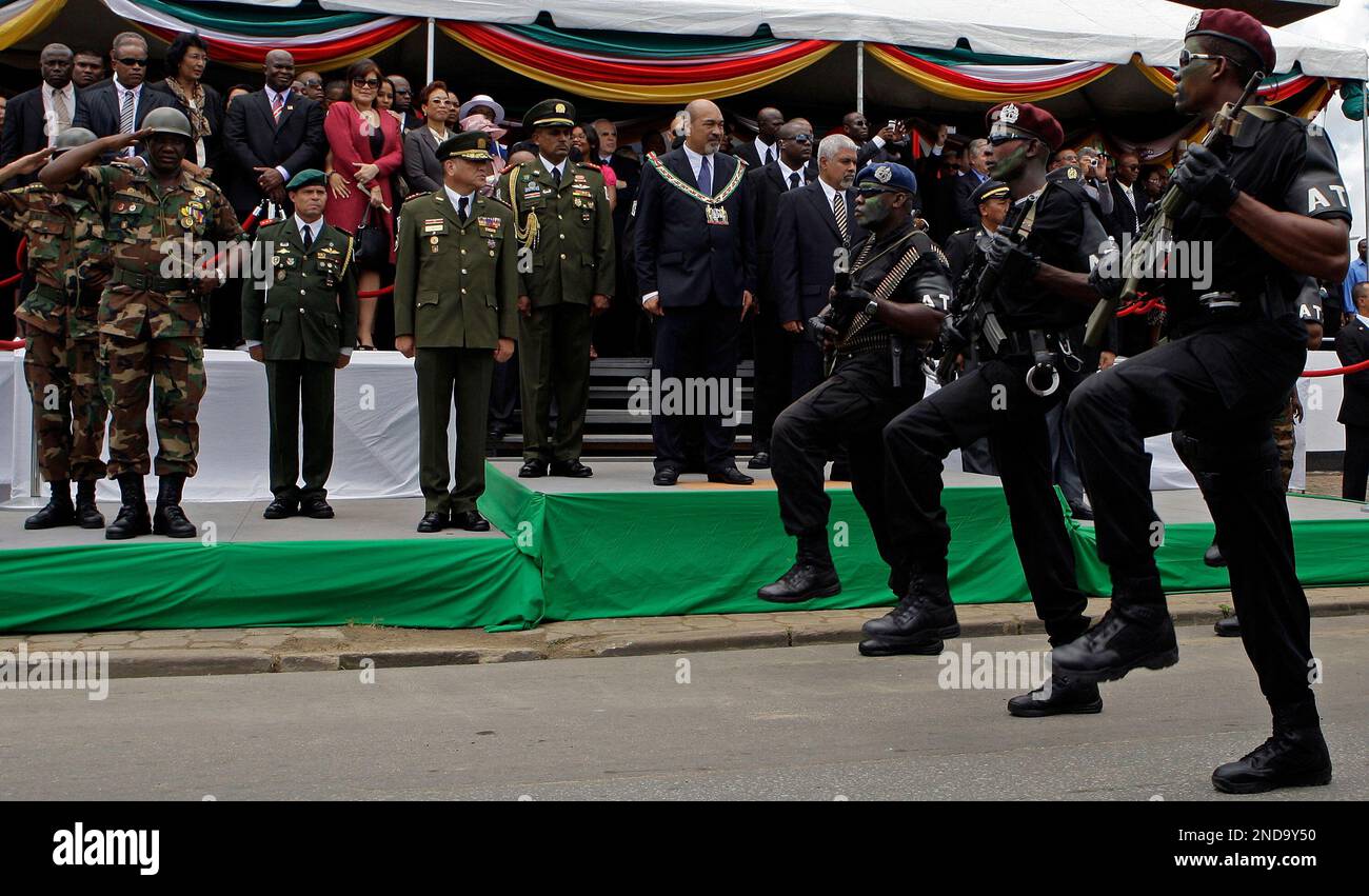Suriname's President Desi Bouterse, center, attends a military parade ...