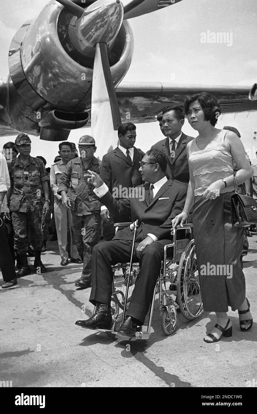 Cambodian Prime Minister Lon Nol is pushed away from U.S. Navy plane in ...
