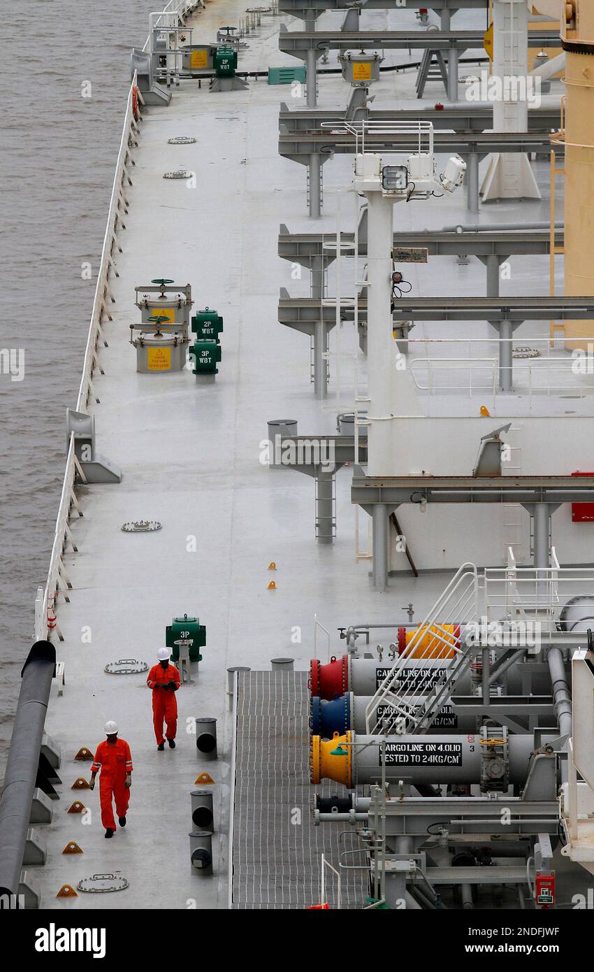 Workers walk along the deck of the "A Whale" skimmer, billed as the ...