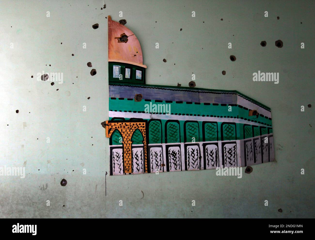 This photo taken on Tuesday June 15, 2010, shows a bullet-ridden wall ...