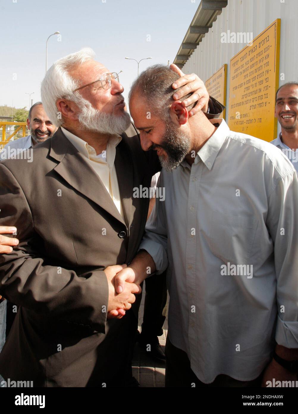 Palestinian Hamas member Aziz Dweik, left, kisses Palestinian Hamas ...