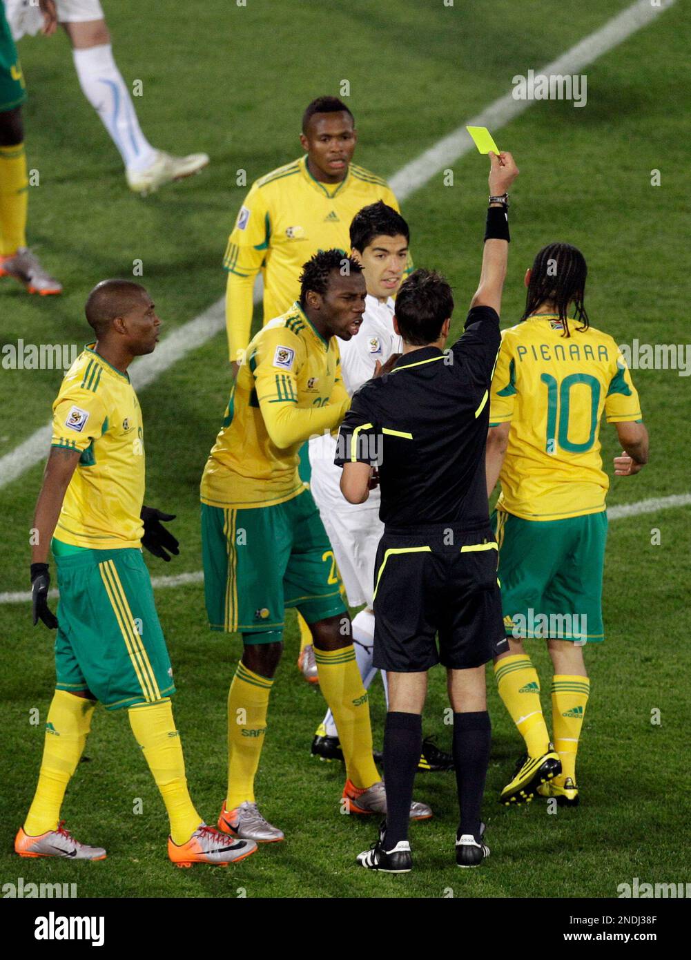 Referee Massimo Busacca, second from right, from Switzerland, shows a ...