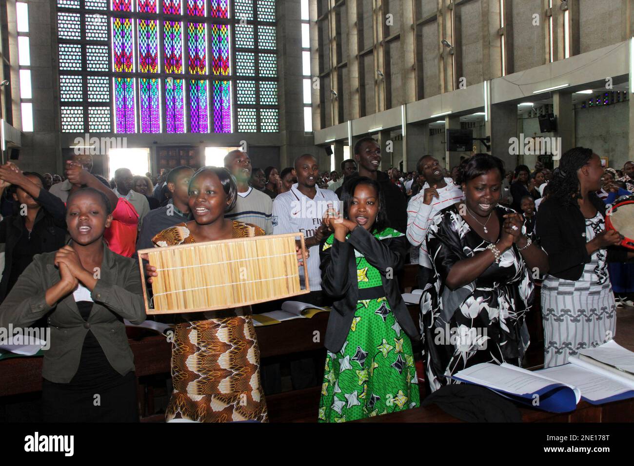 Kenyan Christian sing and praise the Lord as they join a morning ...