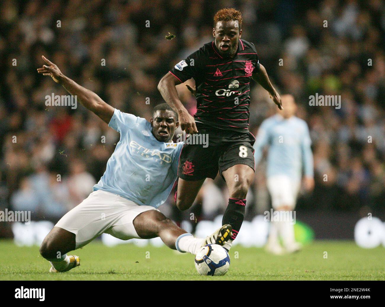 Manchester City's Micah Richards, left, vies for the ball against ...