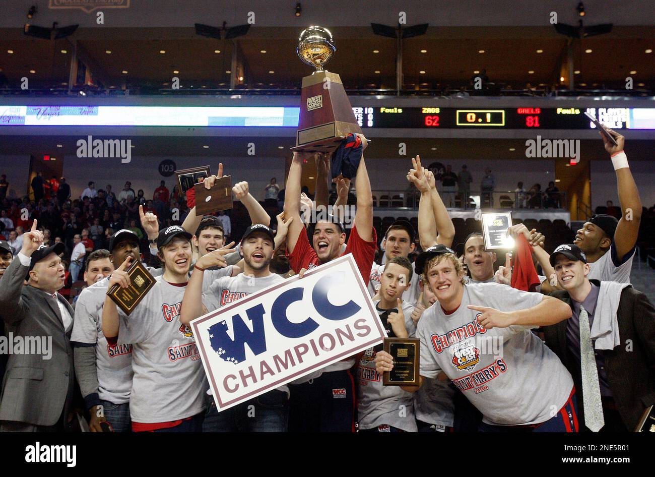 Saint Mary's Omar Samhan, center, hoists the trophy with his team after ...