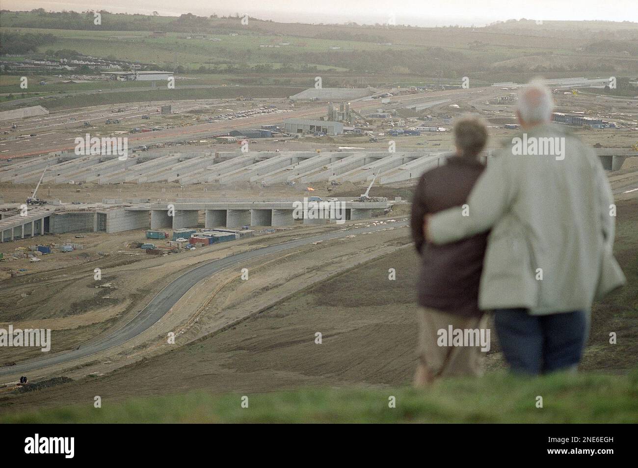 An unidentified couple looks over the work site of the Channel Tunnel ...