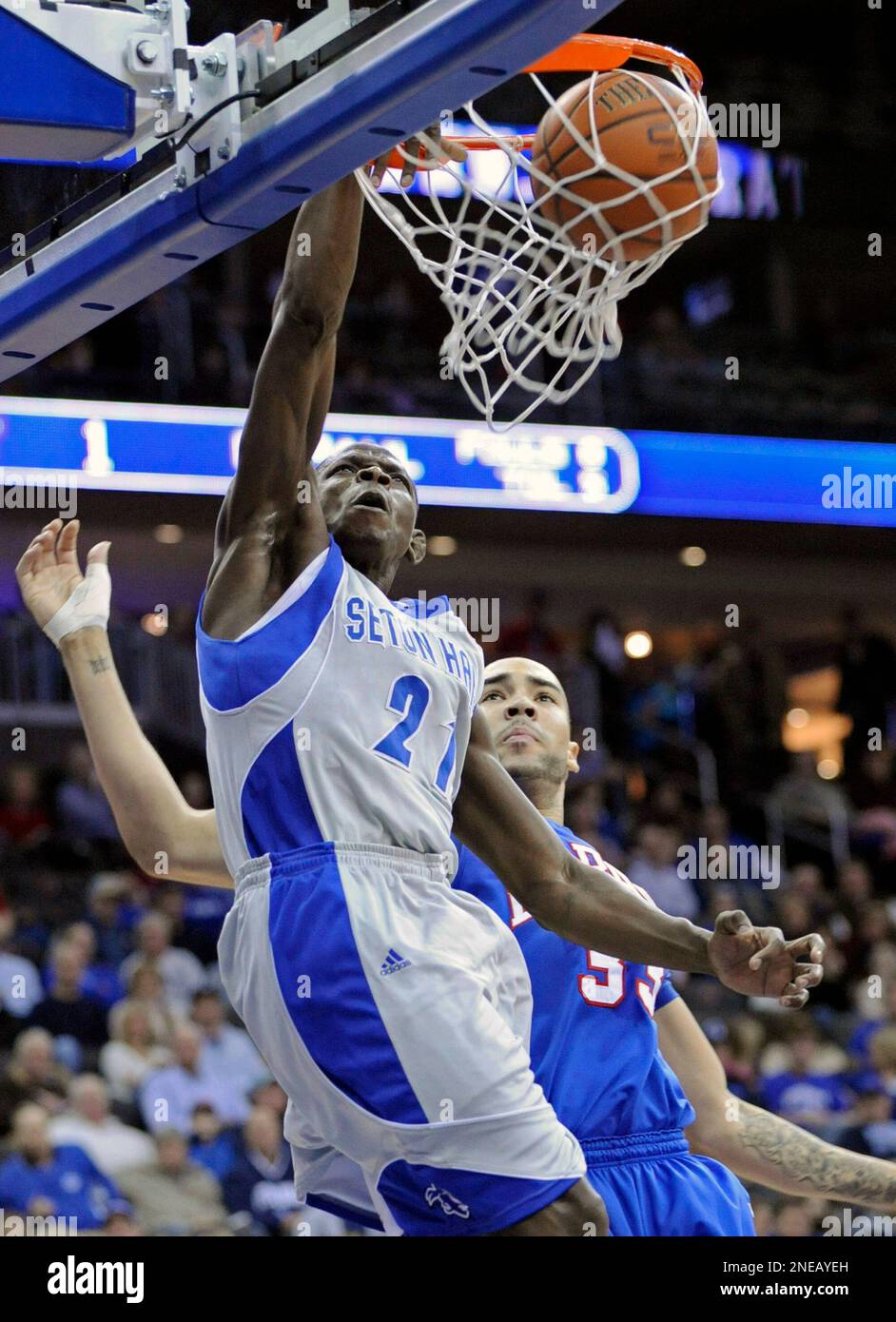 Seton Hall's Jeremy Hazell, left, dunks the ball as he gets by DePaul's ...