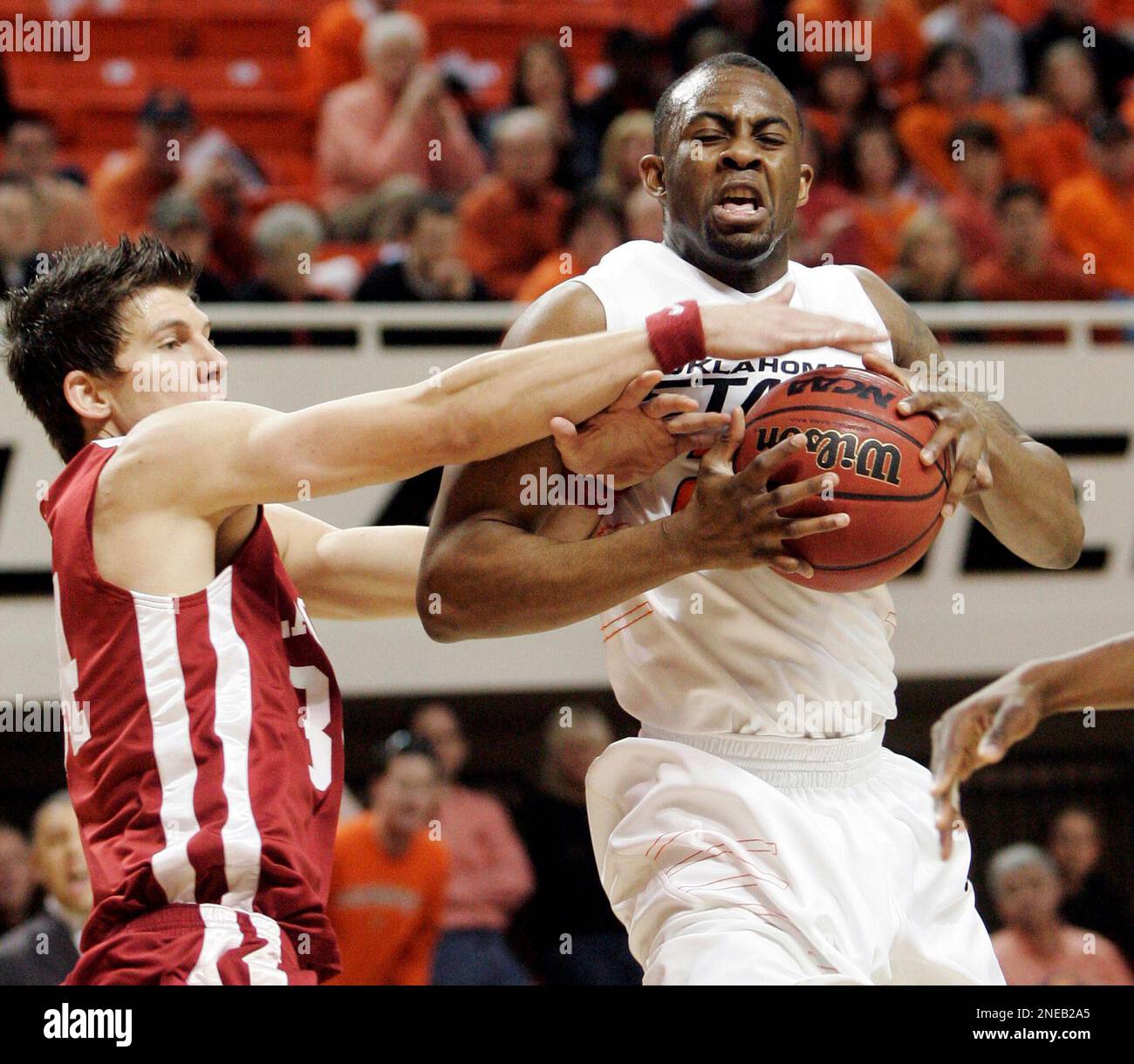 Oklahoma State guard James Anderson, right, is fouled by Oklahoma guard ...
