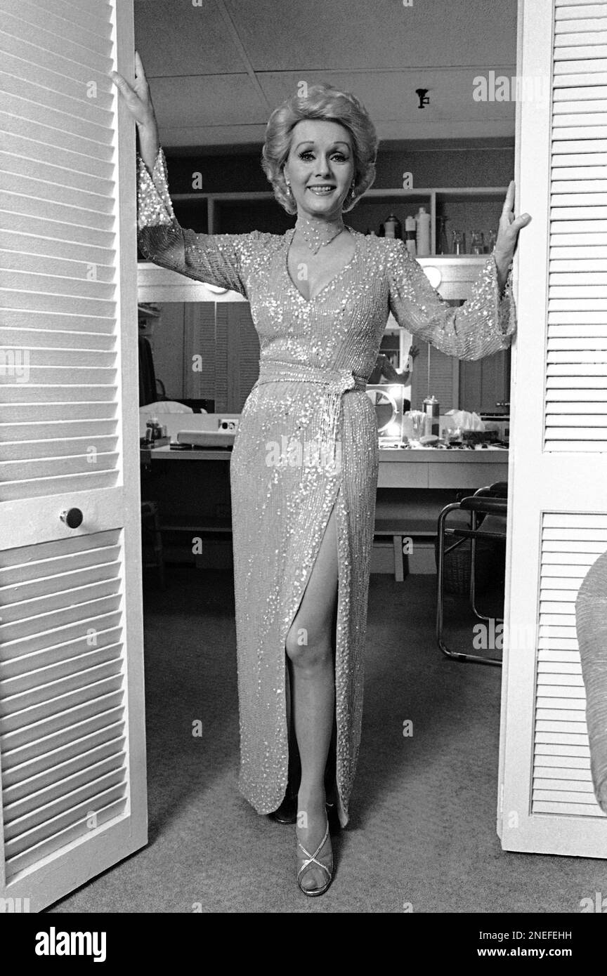 Debbie Reynolds, 51, looks magnificent as the struts her stuff in ...