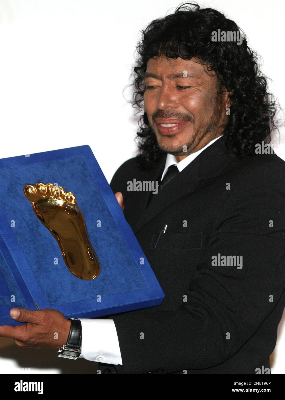 Former Colombian goalkeeper Rene Higuita poses with his "Golden Foot ...