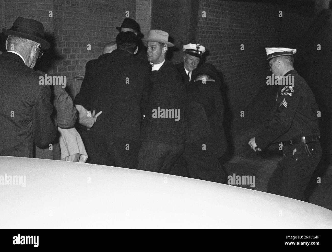 Plainclothes officers of the Dallas Police Department struggle with a ...