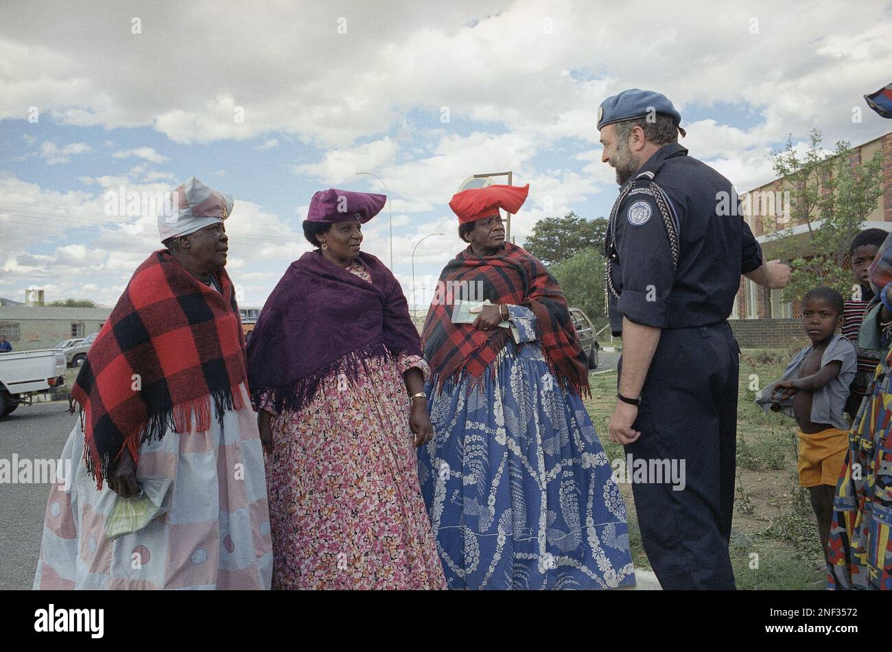 Constable Martin Fokker of the Netherlands (right) chats with three ...