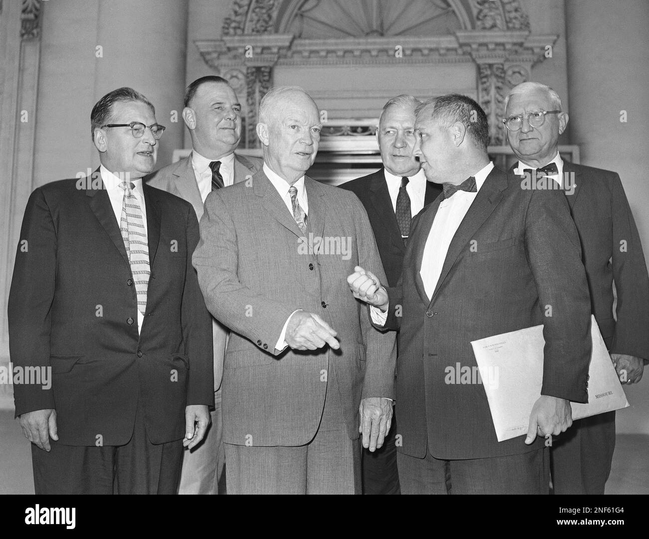 Pres. Dwight D. Eisenhower, center, talks with Rep. Tom Curtis (Mo ...