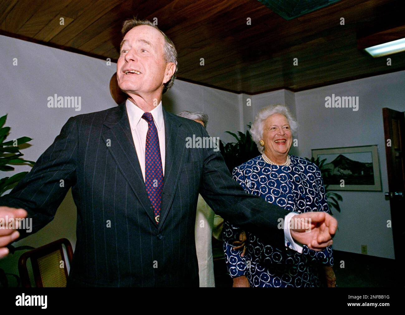 Former President George Bush and former first lady Barbara Bush share a ...
