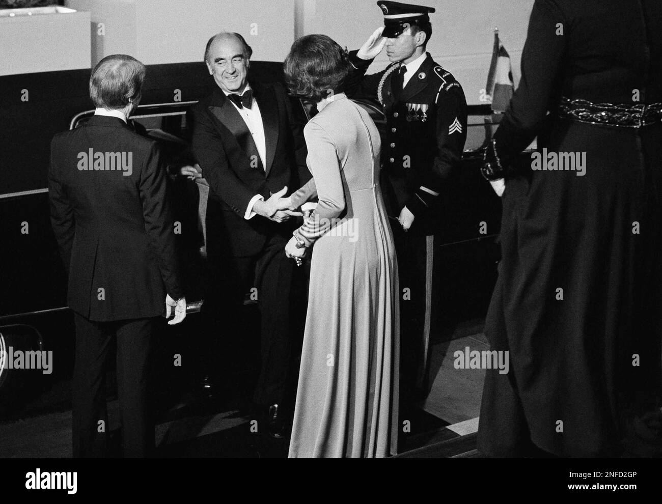 President Jimmy Carter and first lady Rosalynn Carter (backs to camera ...