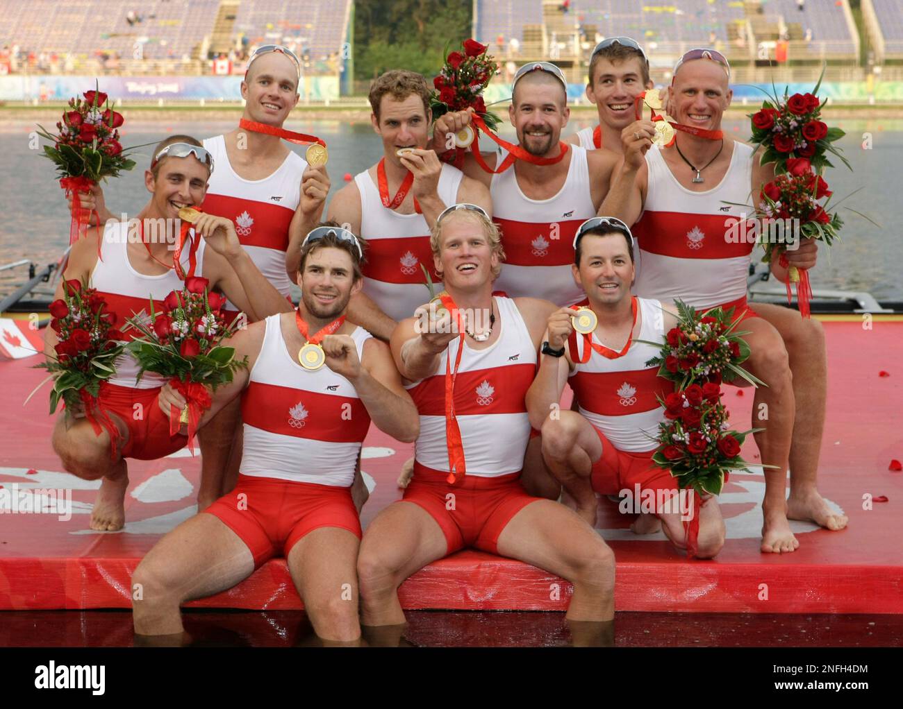Canada’s coxswain Brian Price, sitting first row at right, and temmates ...