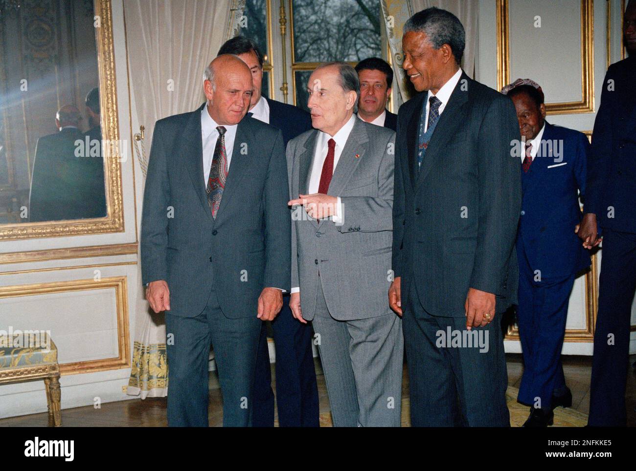 French President Francois Mitterrand, centre, points to his South ...