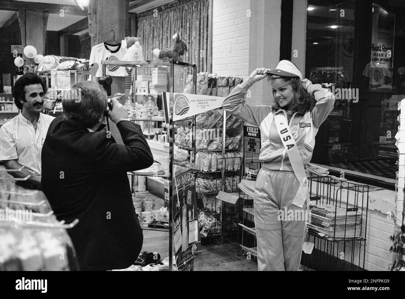 Miss USA of 1983 Julie Hayek adjusts a cap for an admirer who spotted ...