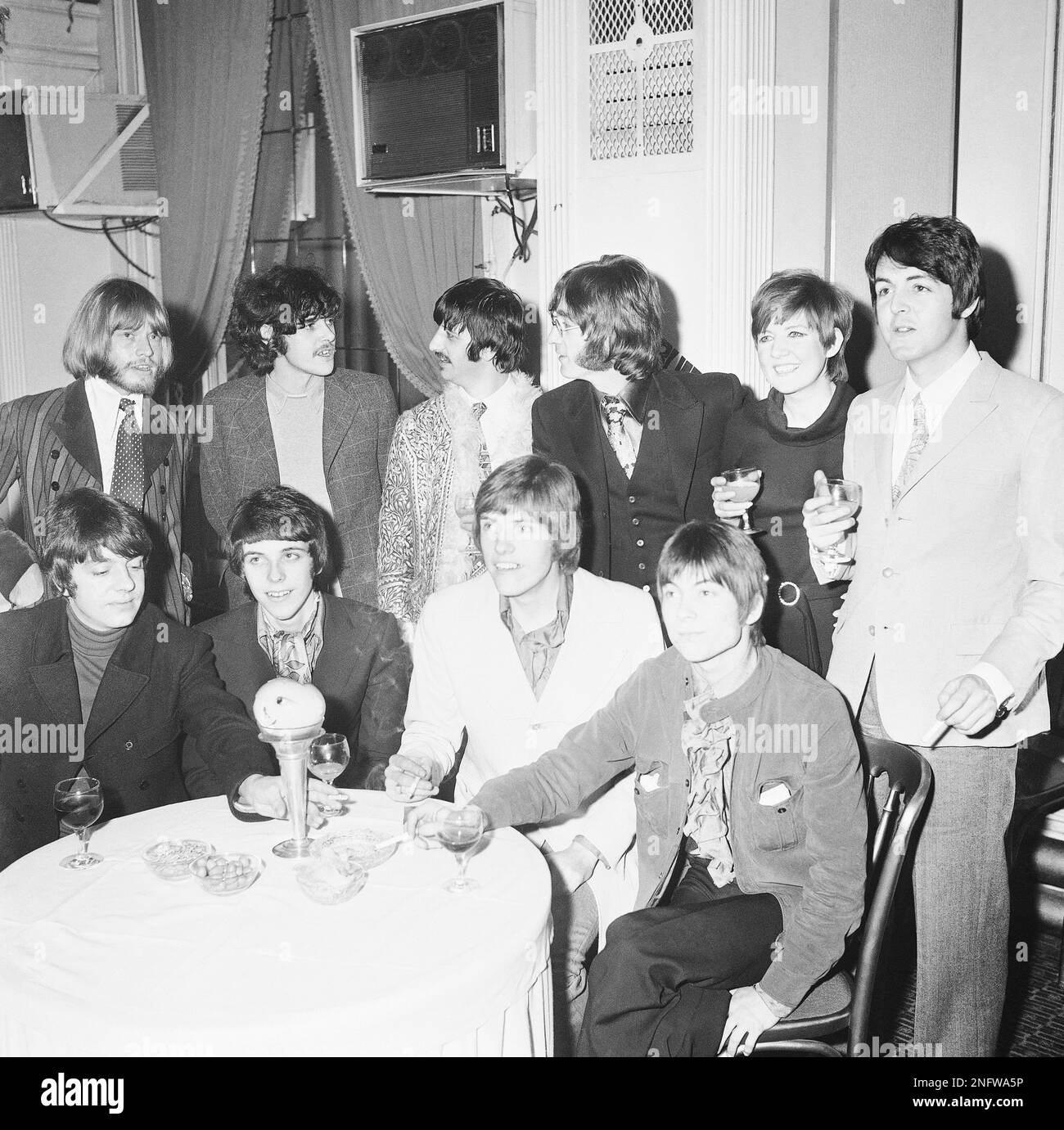 The four members of the "Grapefruit" pop group are seen seated at a ...
