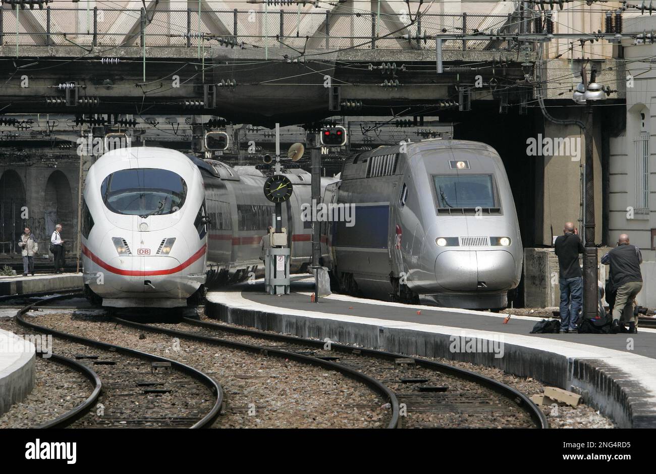 Two high-speed trains one German, left, one French, arrive at the gare ...