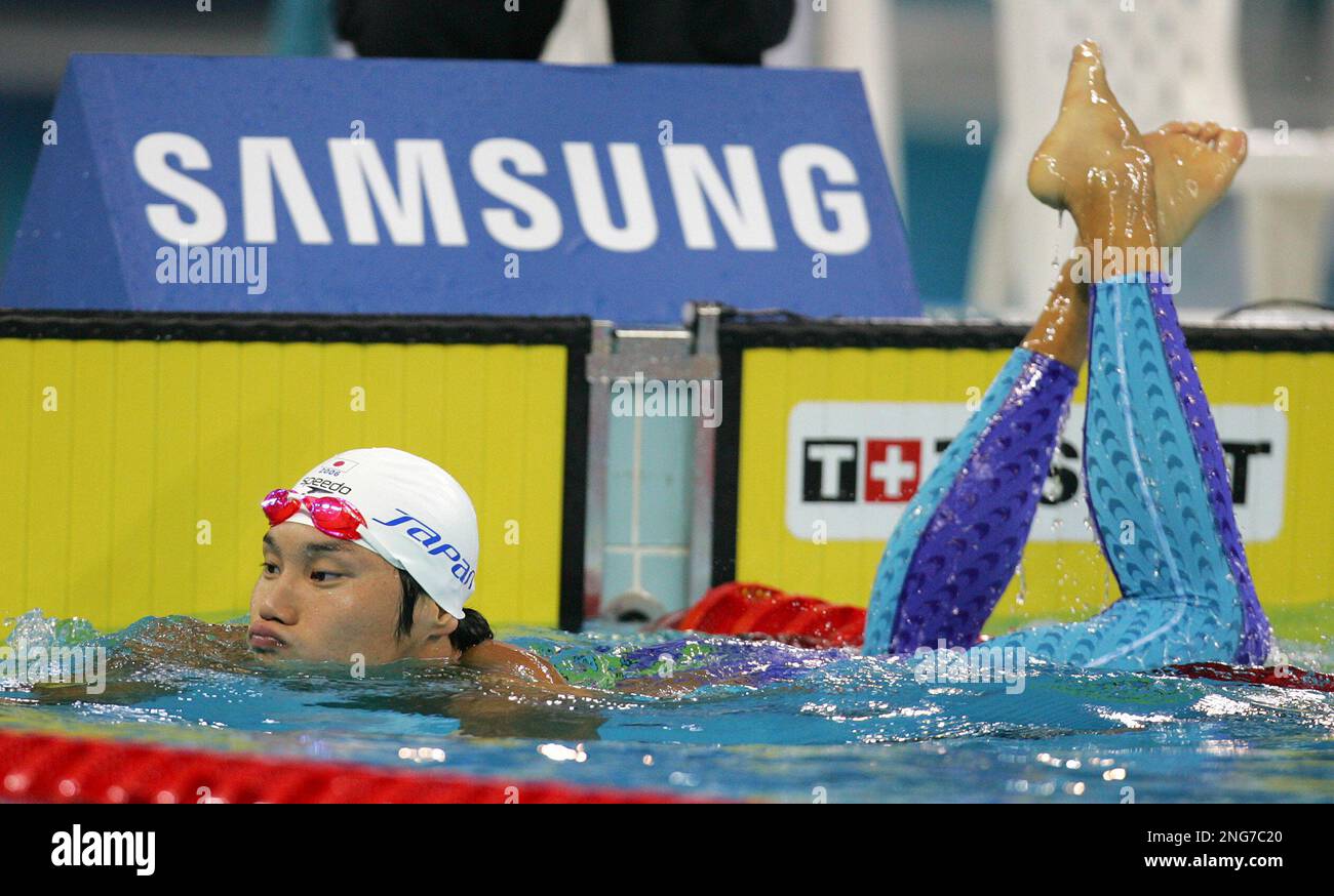 Japan's Daisuke Hosokawa swims from the pool after completing a Men's ...