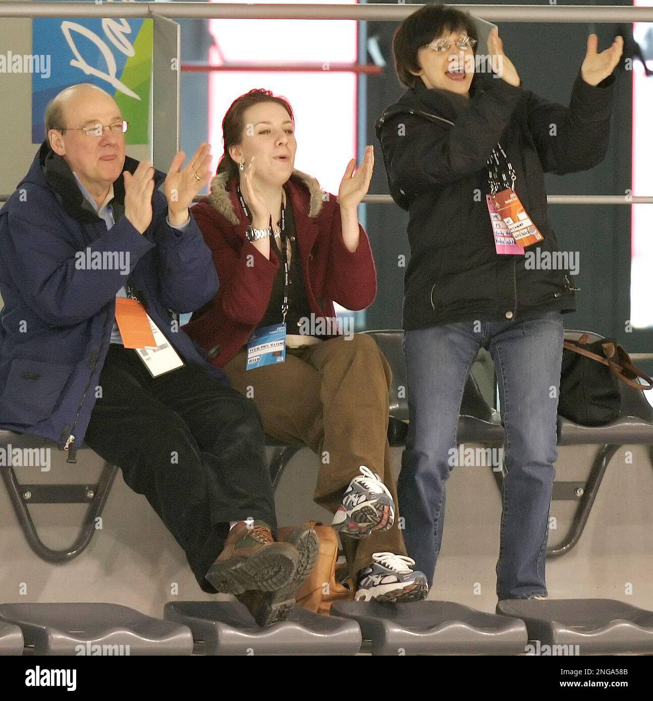 The Hughes family from left, John, Sarah, and Amy watch Emily Hughes ...