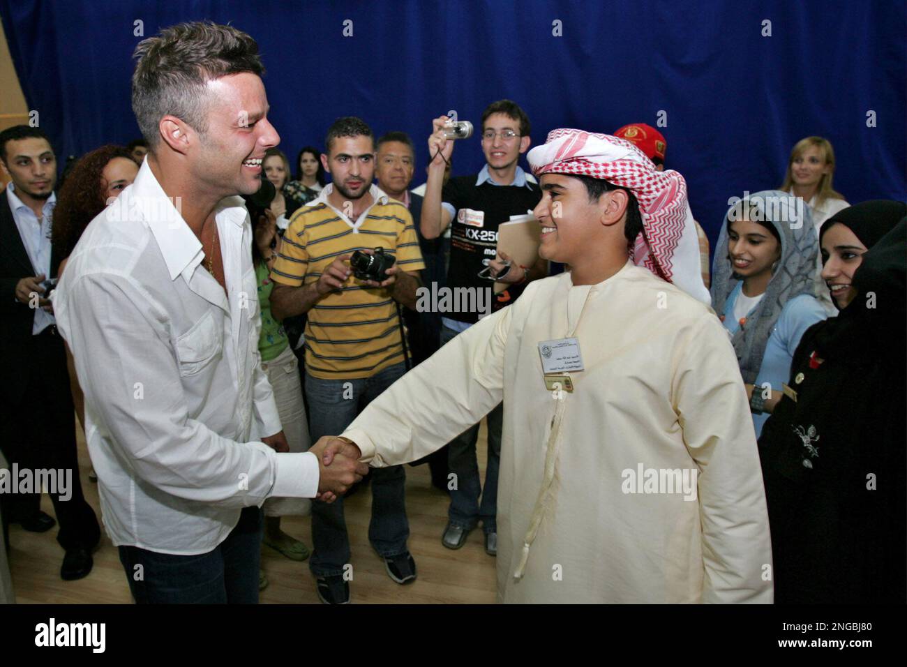 UNICEF goodwill Ambassador singer Ricky Martin, shakes hands with a ...