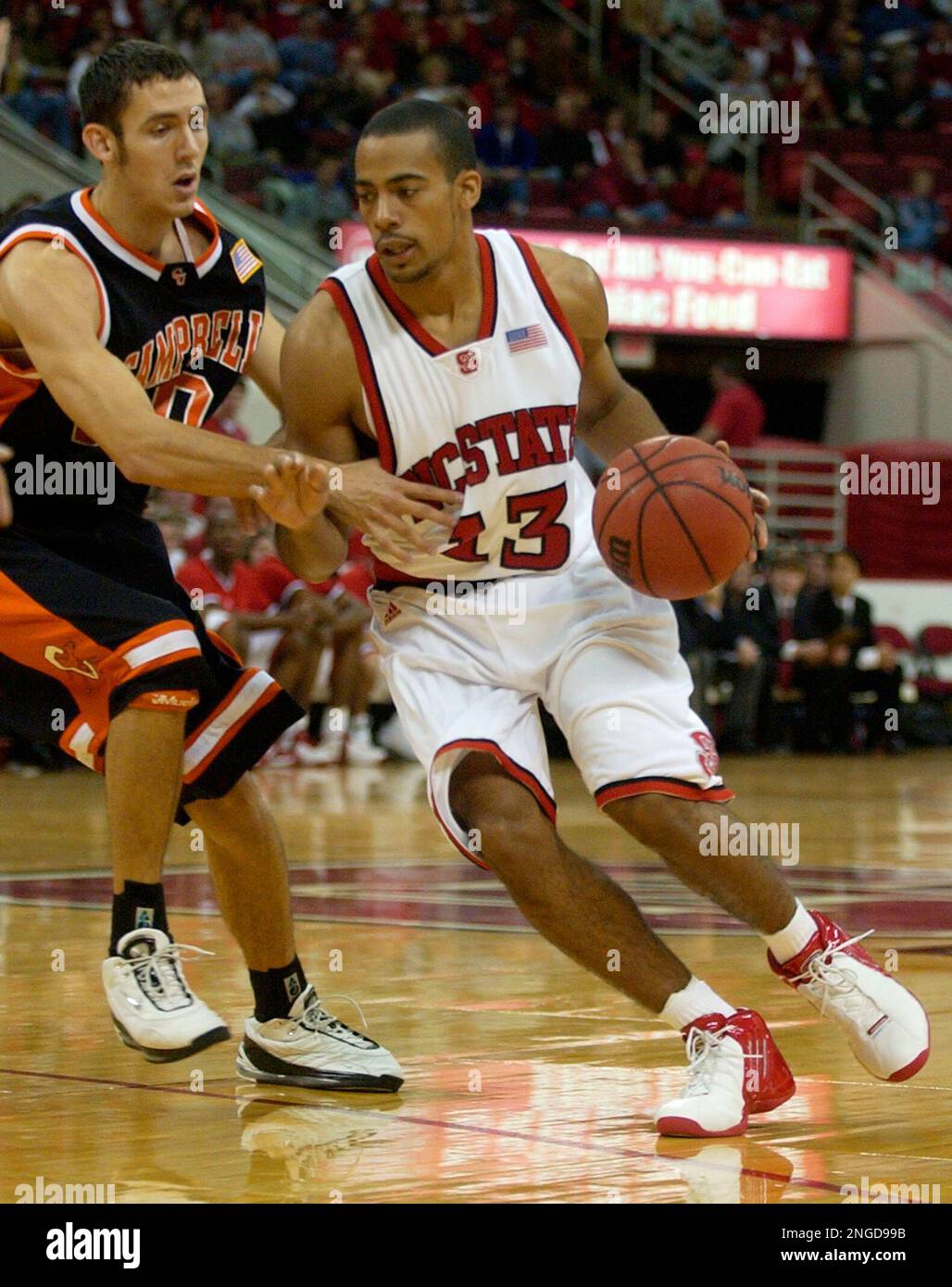 North Carolina State's Cameron Bennerman (13) drives past Campbell's ...