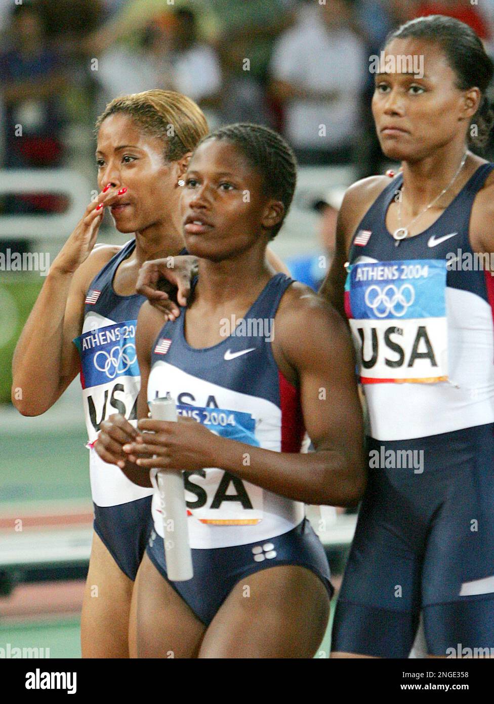 Latasha Colander, left, Lauryn Williams, center, and Marion Jones react ...