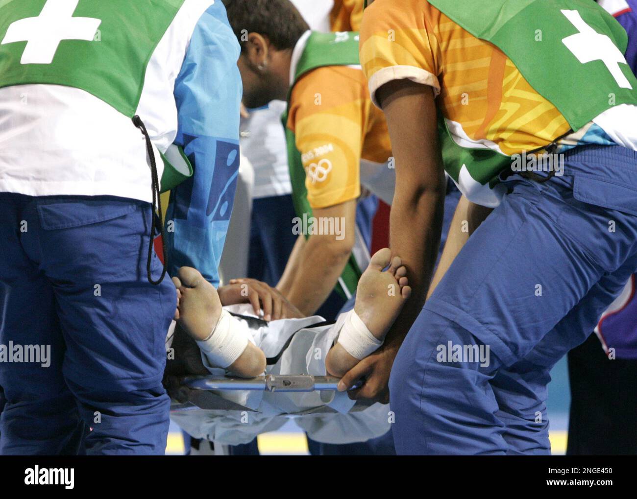 Bertrand Cbongou Liango, from Central African Republic, is lifted onto ...