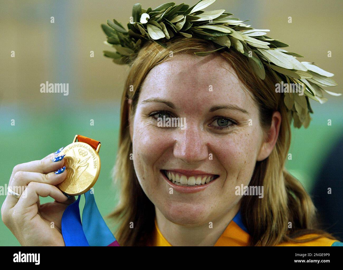 Australia's Anna Meares shows her gold medal after breaking the Olympic ...