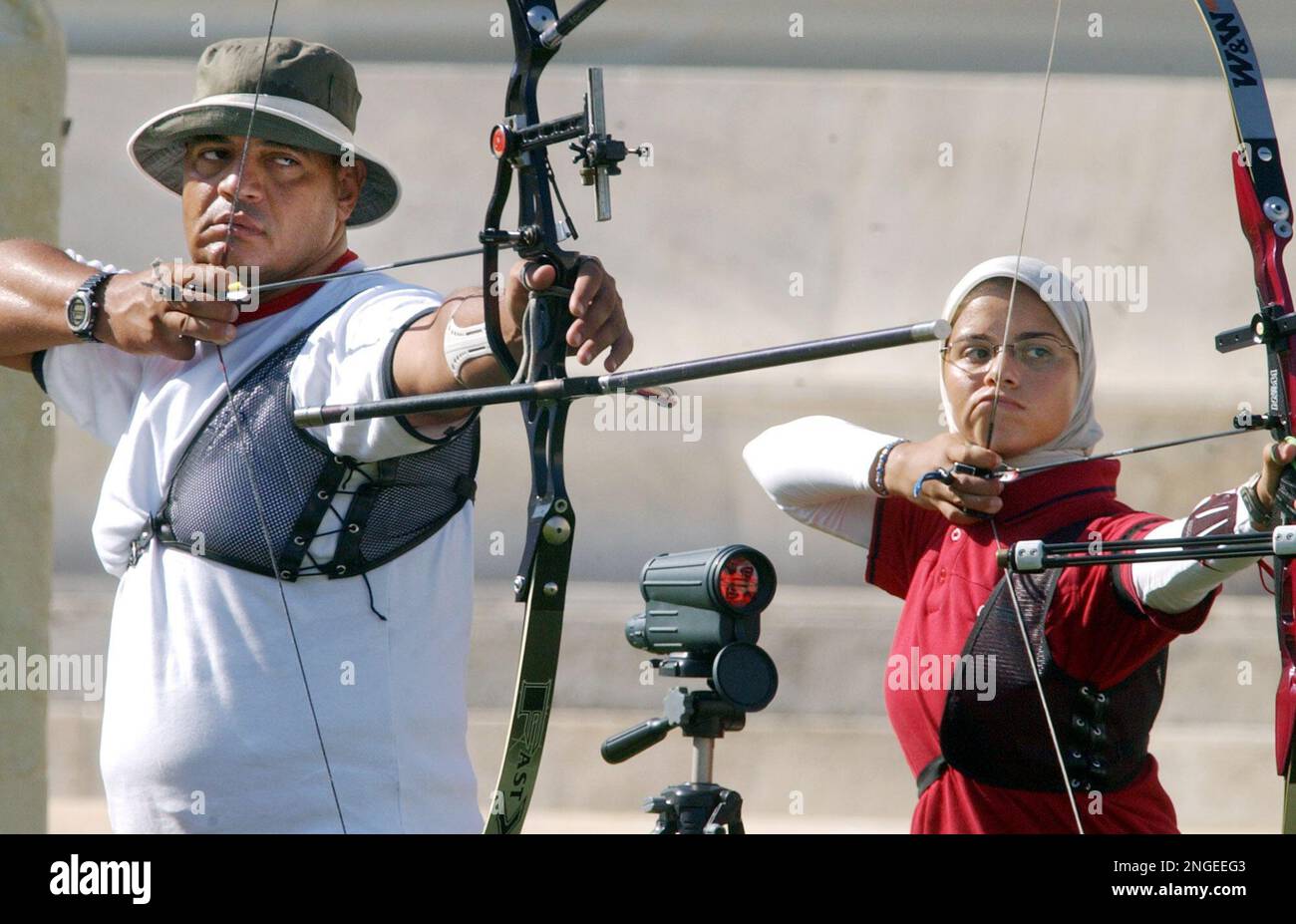 Essam Ismail, left, and May Mansour, of Egypt, take aim during Olympic ...