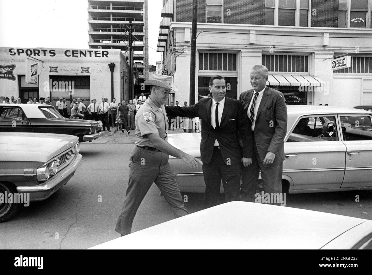 A crowd watches in background as Neshoba County Deputy Sheriff Cecil ...