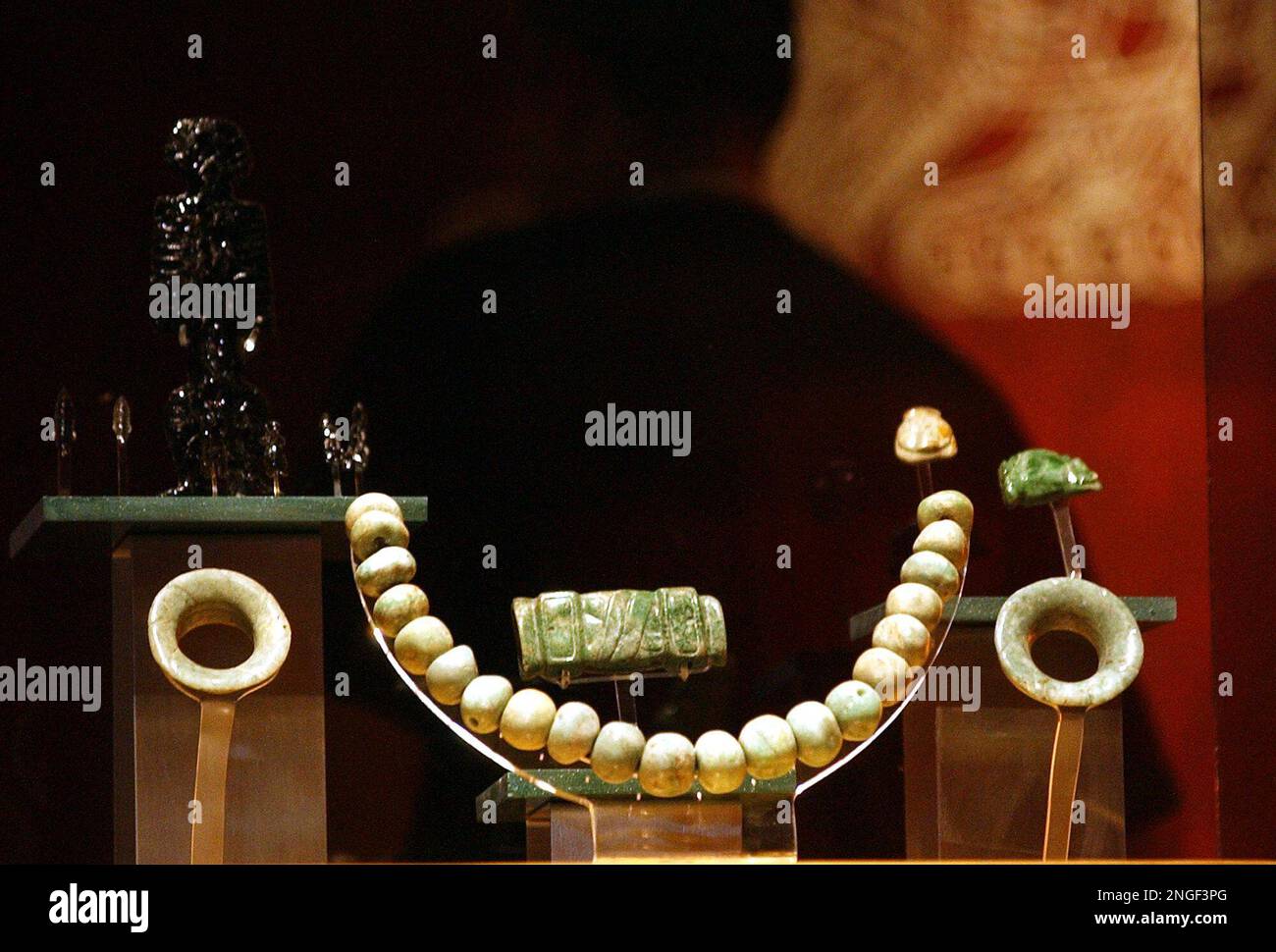 Tomb artifacts, including jadeite necklaces, obsidian decorations and ...